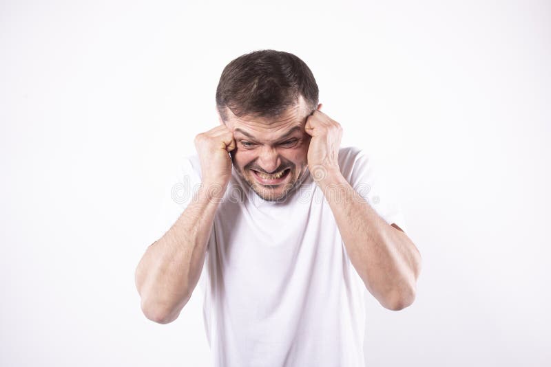 Man In Panic Attack Hands At Temples Teeth Clenched Isolated White