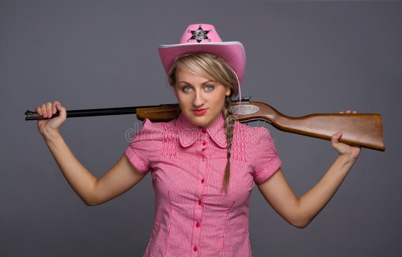 Attractive Cawbow Girl with Shot Gun Over Back Stock Image - Image of ...