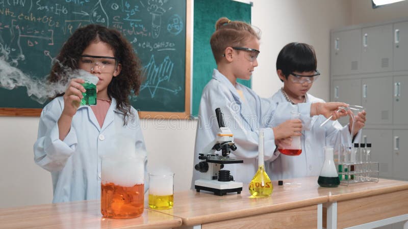 Attractive Children Doing Experiment in Science Lesson at Laboratory ...