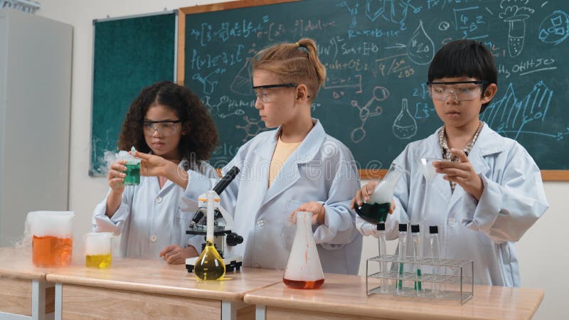 Attractive Children Doing Experiment in Science Lesson at Laboratory ...