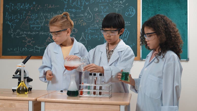 Attractive Children Doing Experiment in Science Lesson at Laboratory ...