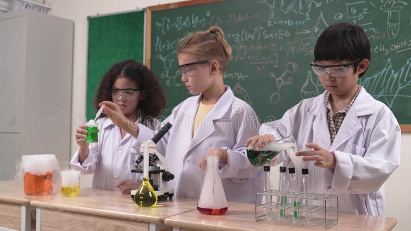 Attractive Children Doing Experiment in Science Lesson at Laboratory ...