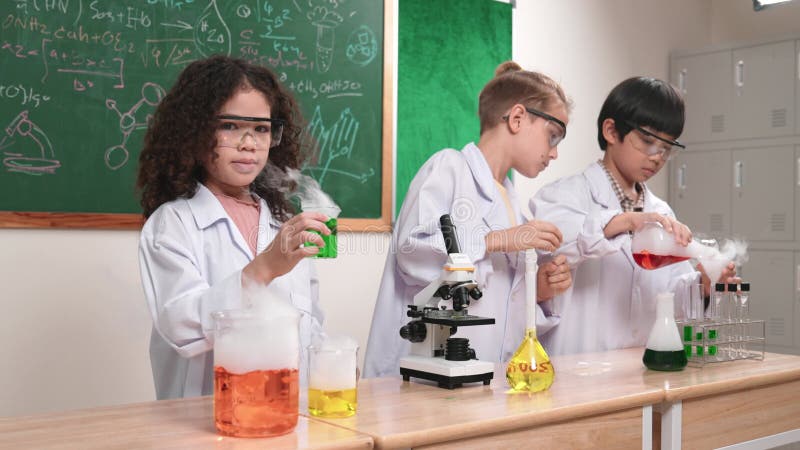 Attractive Children Doing Experiment in Science Lesson at Laboratory ...