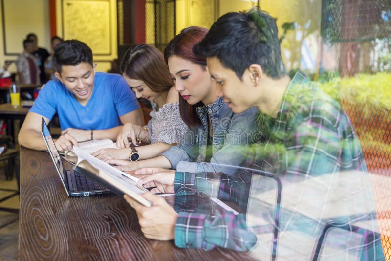 Attractive College Students Studying in Cafe Stock Image - Image of ...