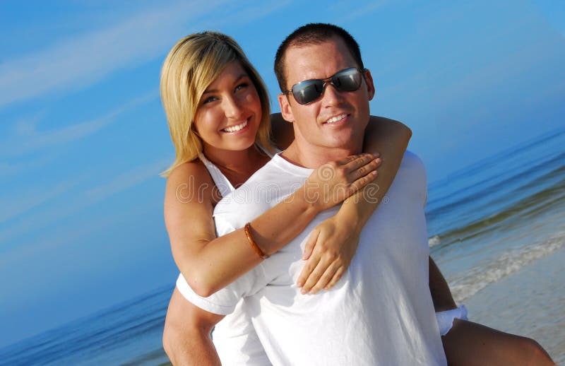 Attractive couple at beach stock image. Image of love - 6380953