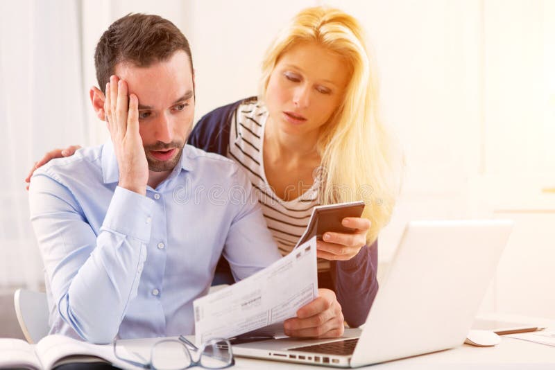 Attractive Couple Doing Administrative Paperwork Stock Image - Image of ...