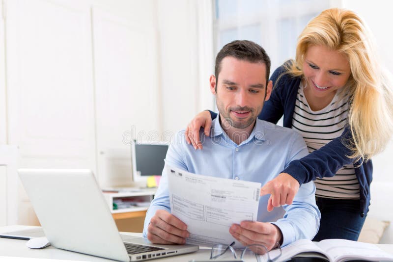 Attractive Couple Doing Administrative Paperwork Stock Image - Image of ...