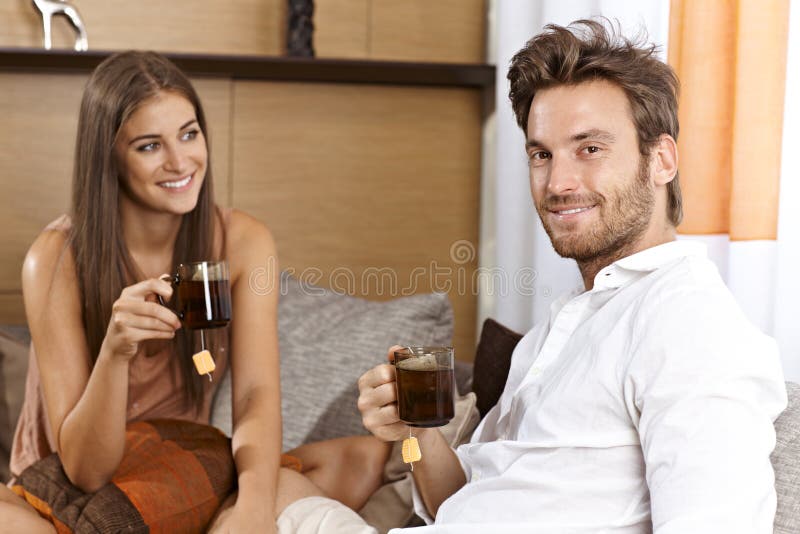 Attractive Couple Having Tea at Home Stock Image - Image of caucasian ...