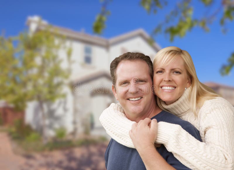 Attractive Couple Hugging in Front of House Stock Image - Image of ...