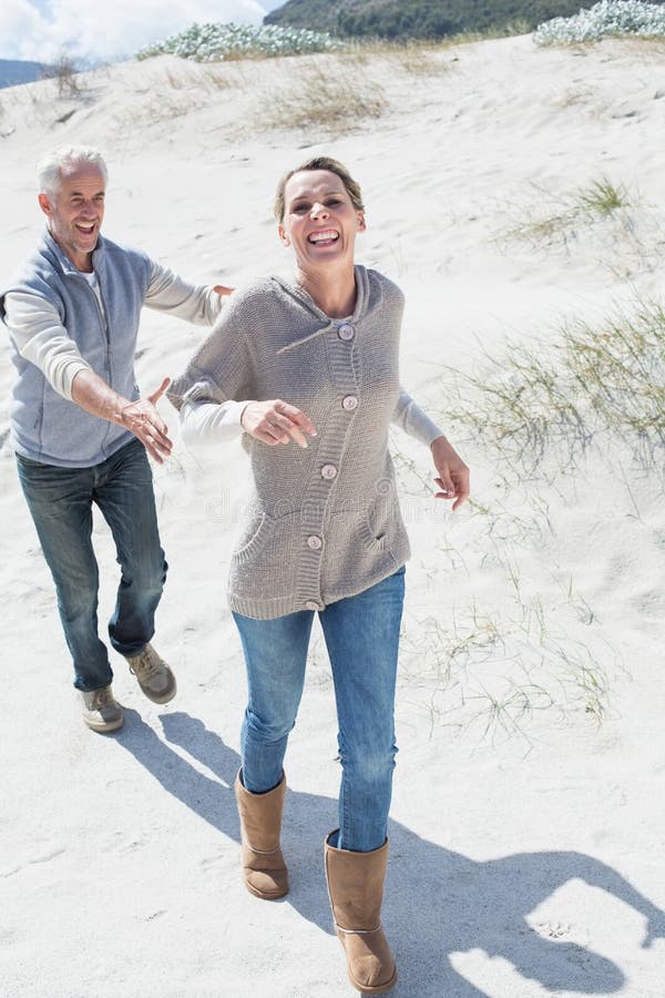 Attractive Couple Playing Chasing on the Beach Stock Image - Image of ...