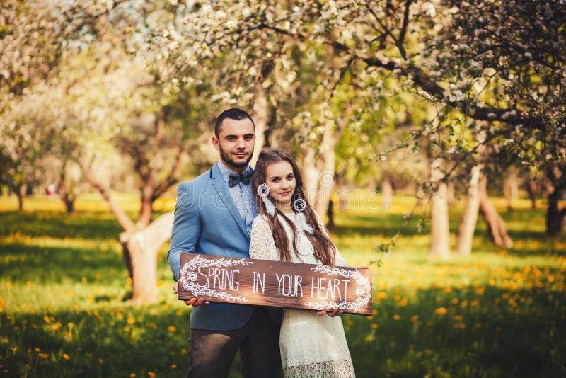 Attractive Couple Standing in the Spring Garden Stock Photo - Image of ...