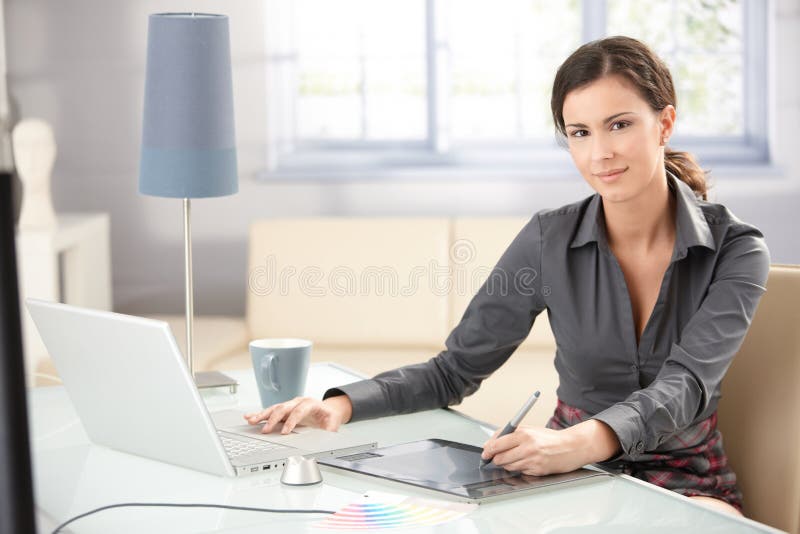 Attractive Designer Using Tablet and Laptop Stock Image - Image of ...