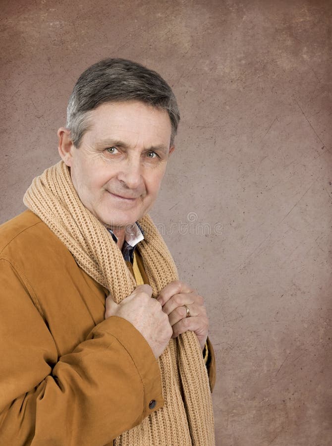 Attractive Elderly Man Elegantly Dressed in Sweater Jacket and Scarf ...