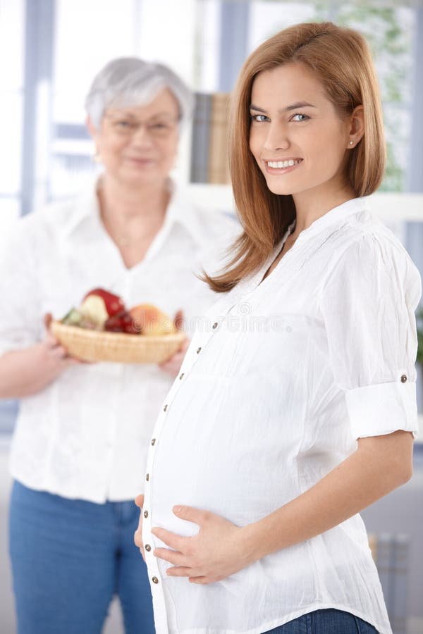 Attractive Expectant Mother Touching Her Belly Stock Photo - Image of ...