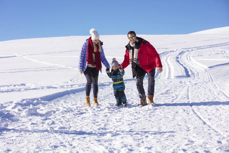 Attractive Family Having Fun in a Winter Park on Mountain Stock Photo ...