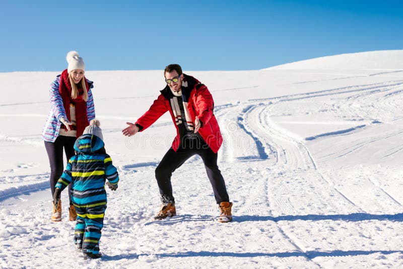 Attractive Family Having Fun in a Winter Park on Mountain Stock Photo ...