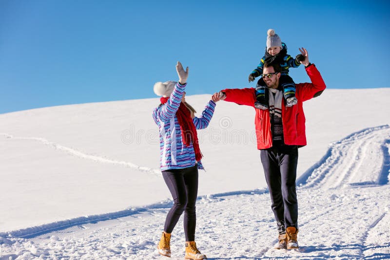 Attractive Family Having Fun in a Winter Park on Mountain Stock Image ...