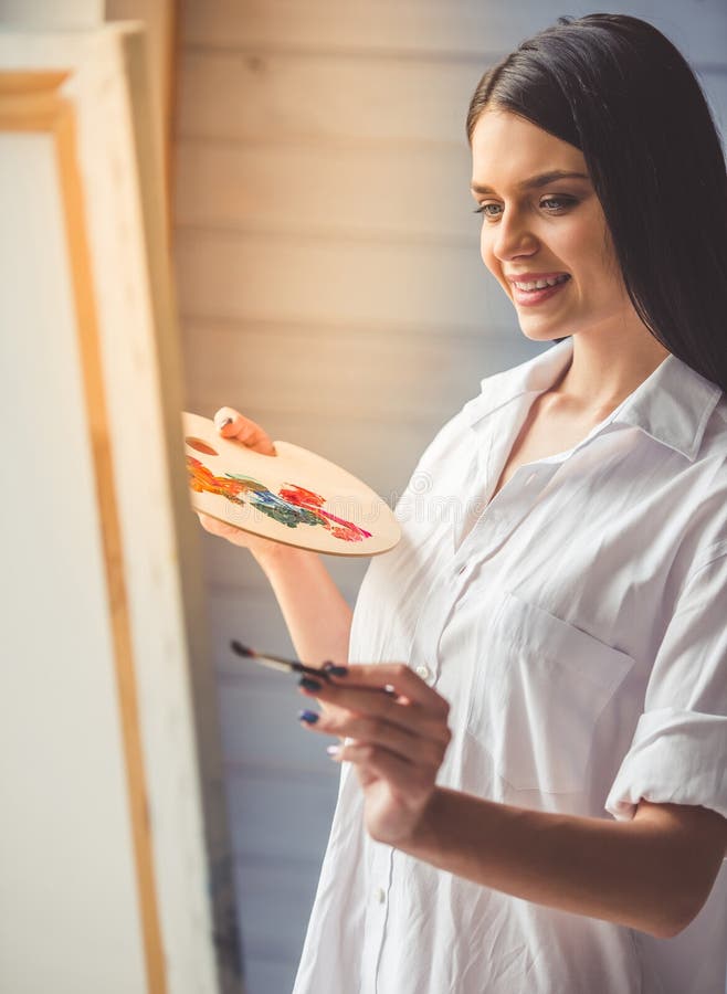 Attractive female artist stock image. Image of expression - 78706163