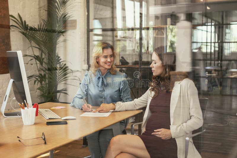 Attractive Female Colleagues Collaborating Stock Photo - Image of ...