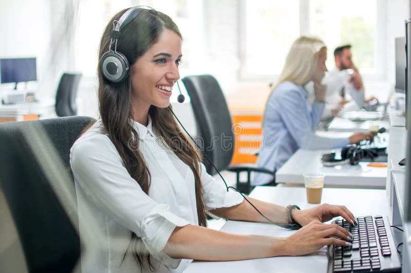 Attractive Female Customer Support Telephone Operator Working in Call ...