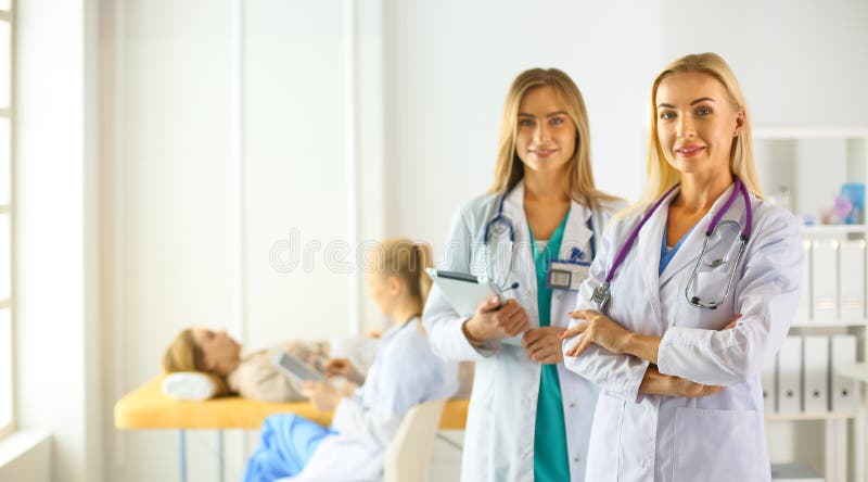 Attractive Female Doctor in Front of Medical Group Stock Image - Image ...