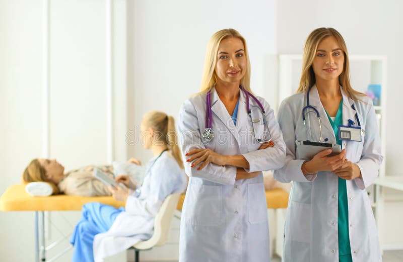 Attractive Female Doctor in Front of Medical Group Stock Photo - Image ...