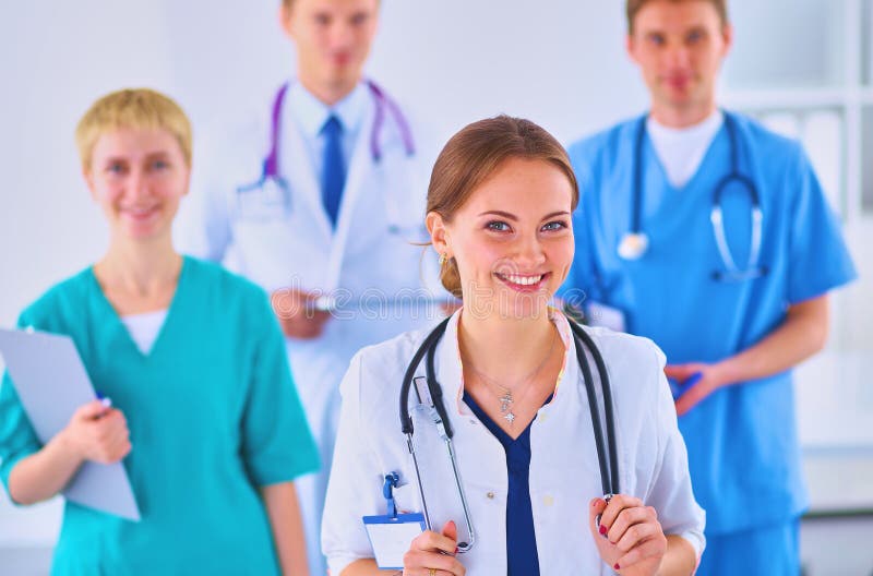 Attractive Female Doctor in Front of Medical Group Stock Photo - Image ...
