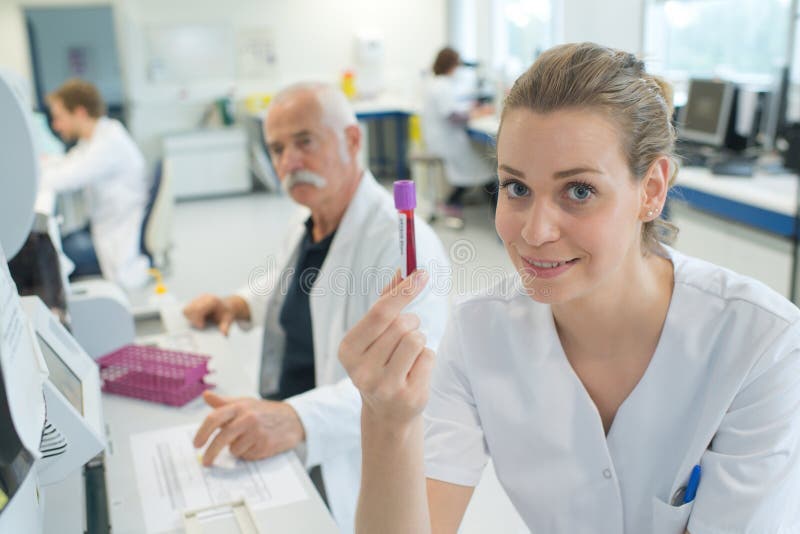 Attractive Female Doctor Showing Blood Test Stock Image - Image of ...