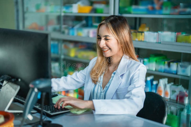 Attractive Female Pharmacist in Uniform Working on Pc Computer Stock ...
