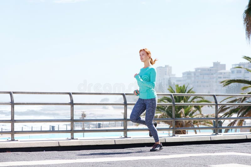 Attractive Female Runner Training on Path Outdoors by Sea Stock Image ...