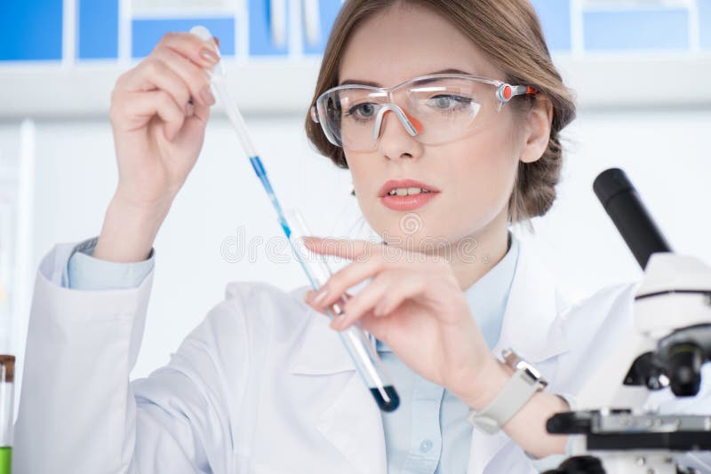 Attractive Female Scientist Stock Photo - Image of experiment ...