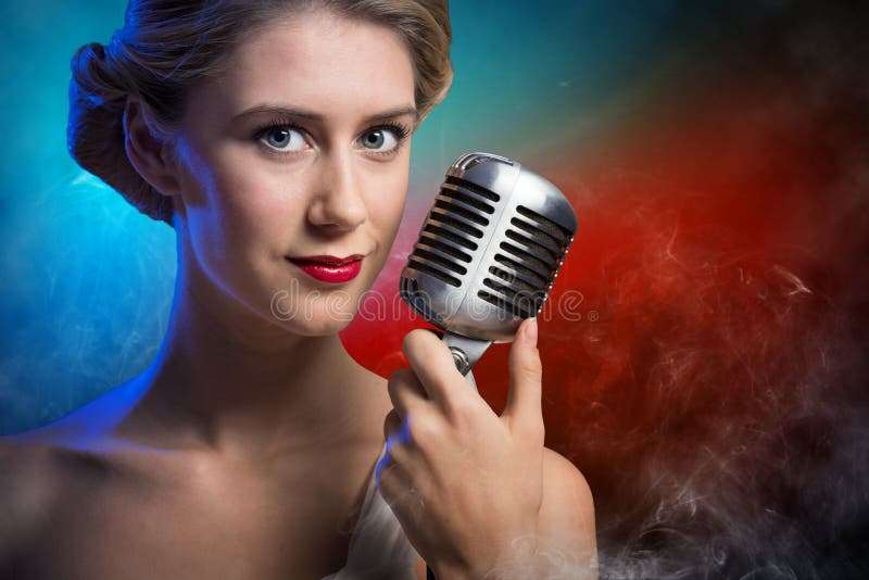 Attractive Female Singer with Microphone Stock Photo - Image of ...