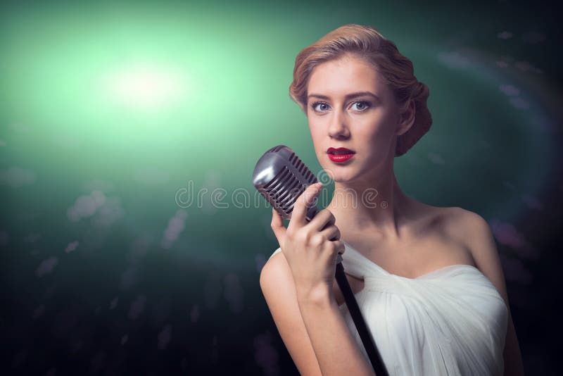Attractive Female Singer with Microphone Stock Photo - Image of ...