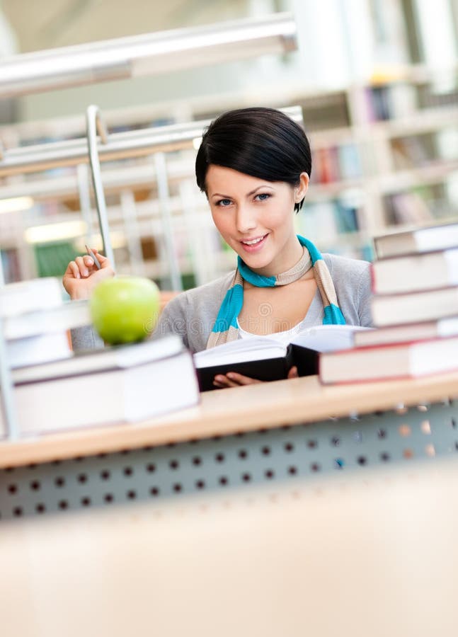 Attractive Female Studies Sitting at the Desk Stock Image - Image of ...