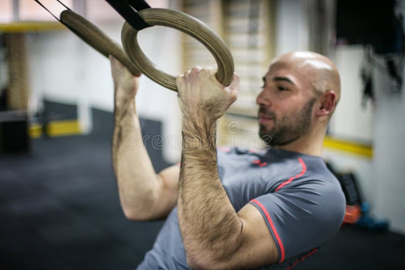 Attractive Fit Man Working Out at the Gym. Stock Image - Image of ...