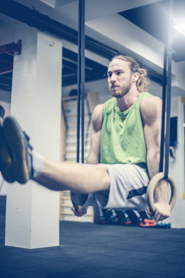 Attractive Fit Man Working Out at the Gym. Stock Photo - Image of ...