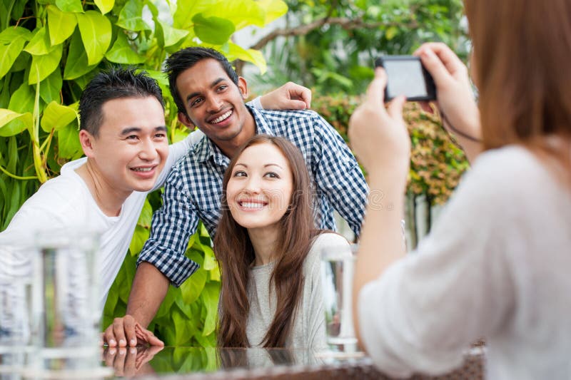 Attractive Friends Using a Camera To Take Photos Stock Photo - Image of ...