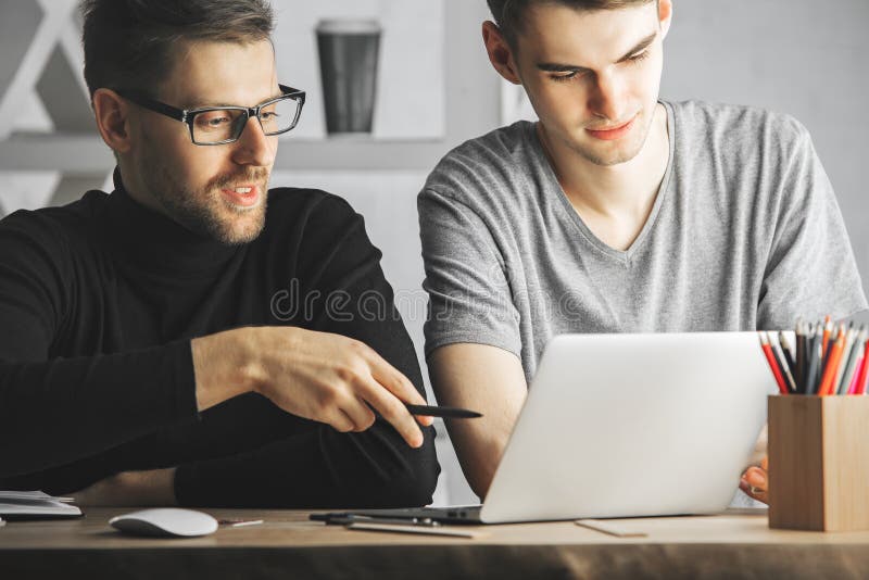 Attractive Gentlemen Discussing Project Stock Photo - Image of guys ...
