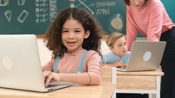 Attractive Girl Coding Prompt while Looking at Camera at STEM Class ...