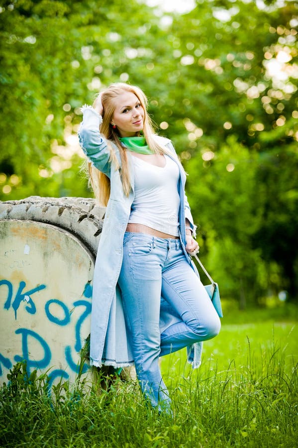 Attractive Girl Posing In Jeans Outdoor Stock Photo - Image of face ...