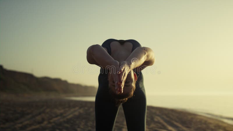 Attractive Girl Pulling Arms Back Practicing Bridge Pose at Sunset ...