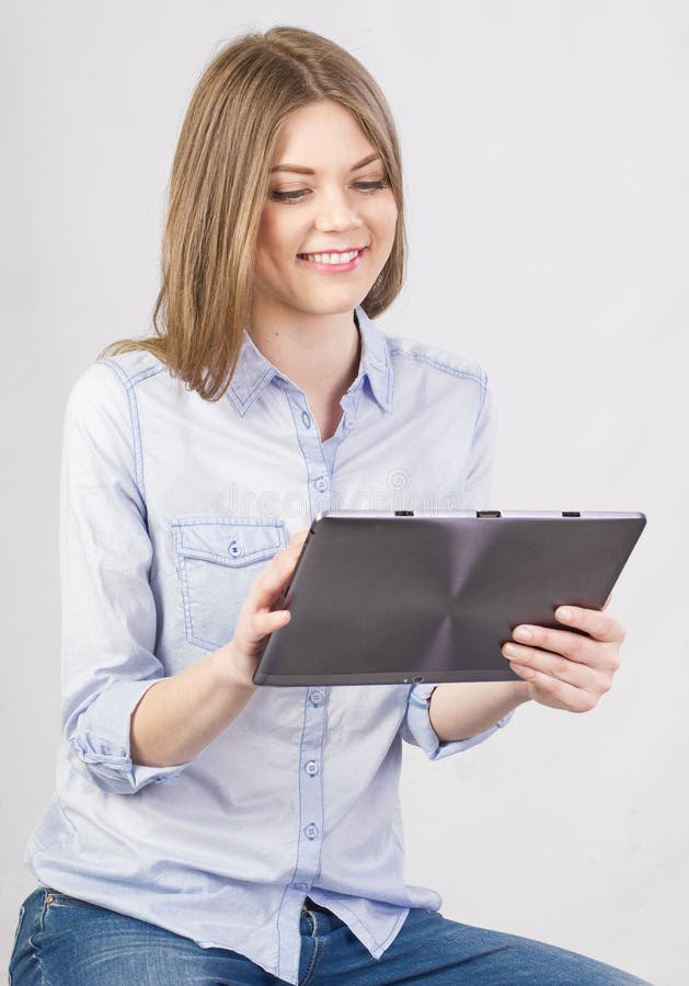 Attractive Girl with Tablet in Studio Stock Image - Image of attractive ...
