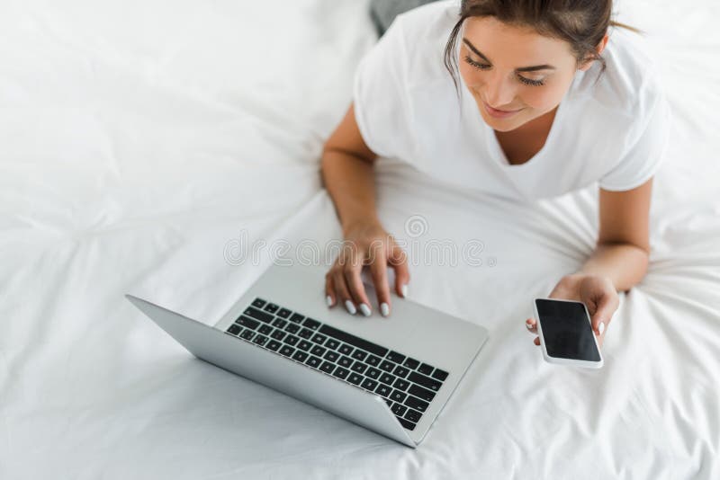 Girl Using Smartphone and Laptop in Bed in the Morning Stock Image ...