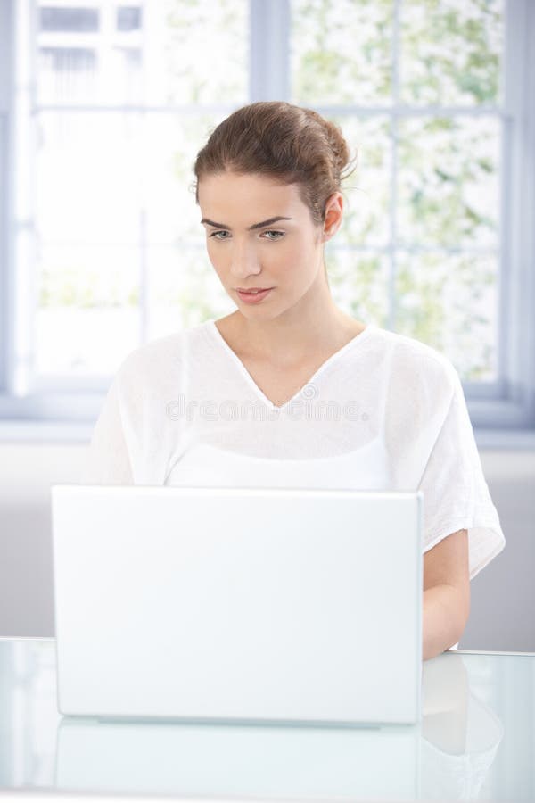 Attractive Girl Working at Home Using Laptop Stock Photo - Image of ...