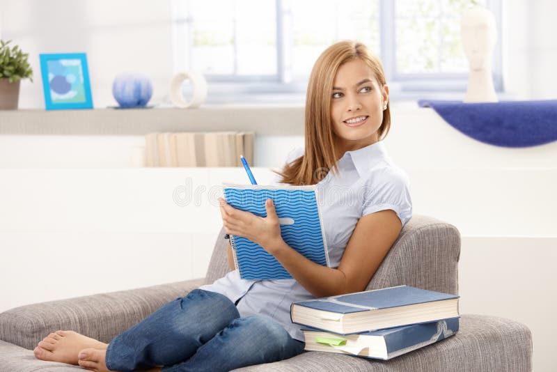 Attractive Girl Writing Notes at Home Smiling Stock Photo - Image of ...
