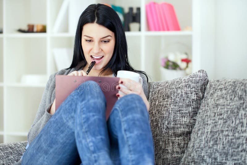Attractive Girl Writing Notes at Home Smiling Stock Image - Image of ...