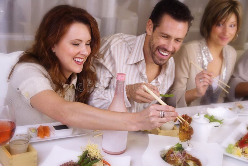 Attractive Group Eating at Restaurant, Stock Image - Image of cuisine ...