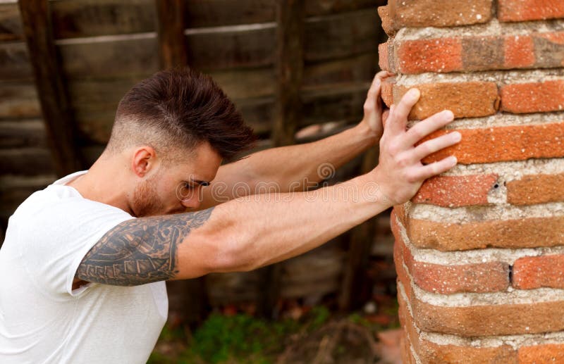 Attractive Guy Next To A Brick Wall Stock Image - Image of macho, cute ...
