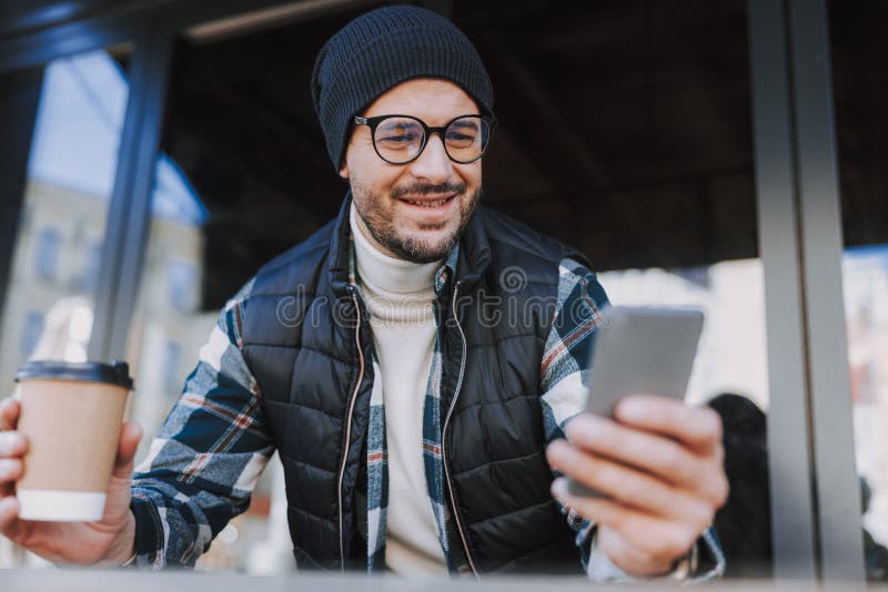 Attractive Guy Reading Message on His Mobile Phone Stock Image - Image ...