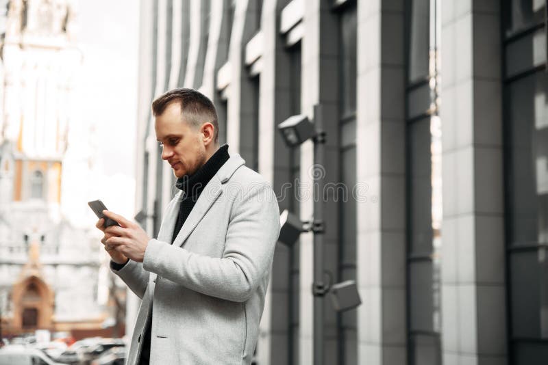 Attractive Guy in Smart Casual with Smartphone Stock Photo - Image of ...